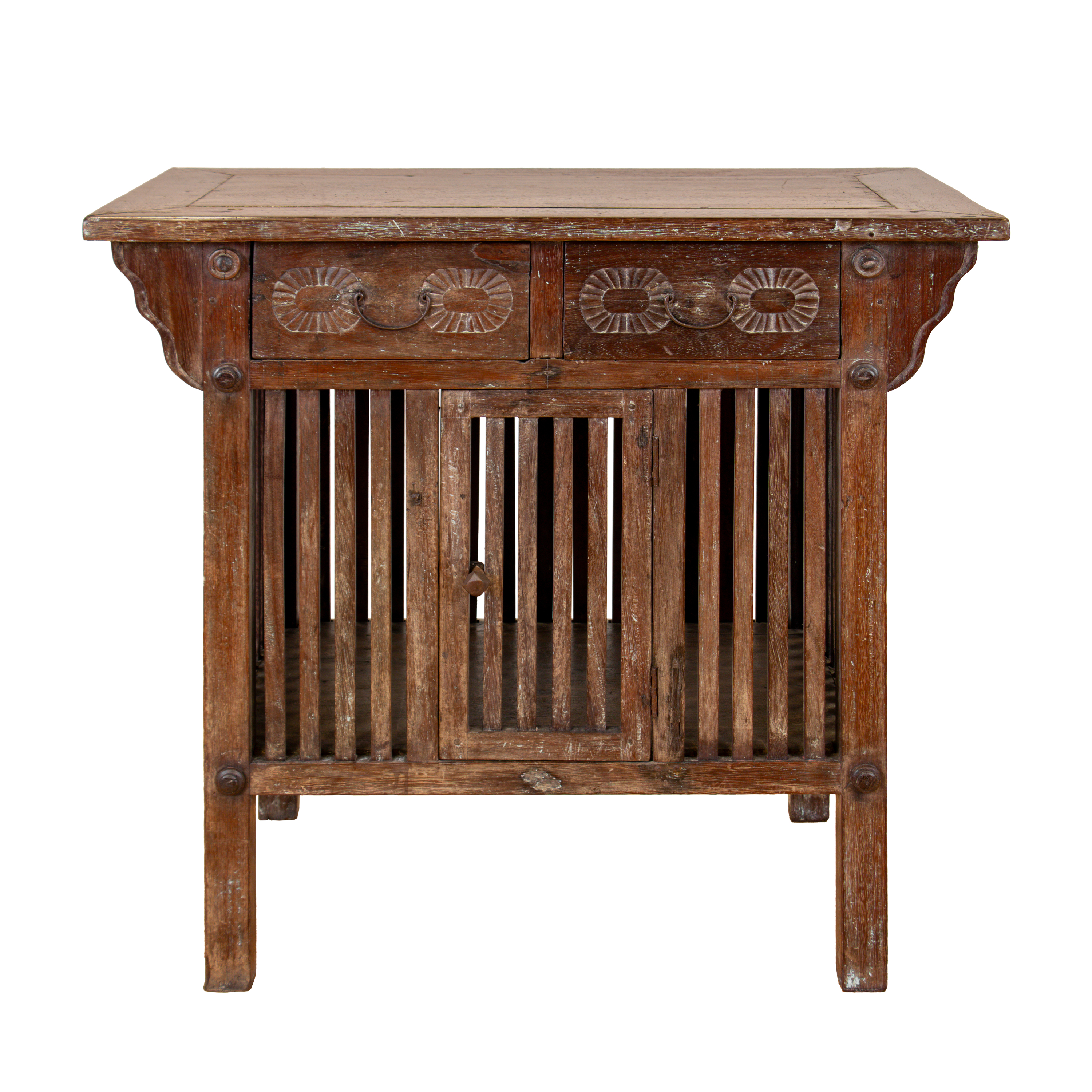 - A slatted paminggalan or cupboard with fluted sunburst carvings