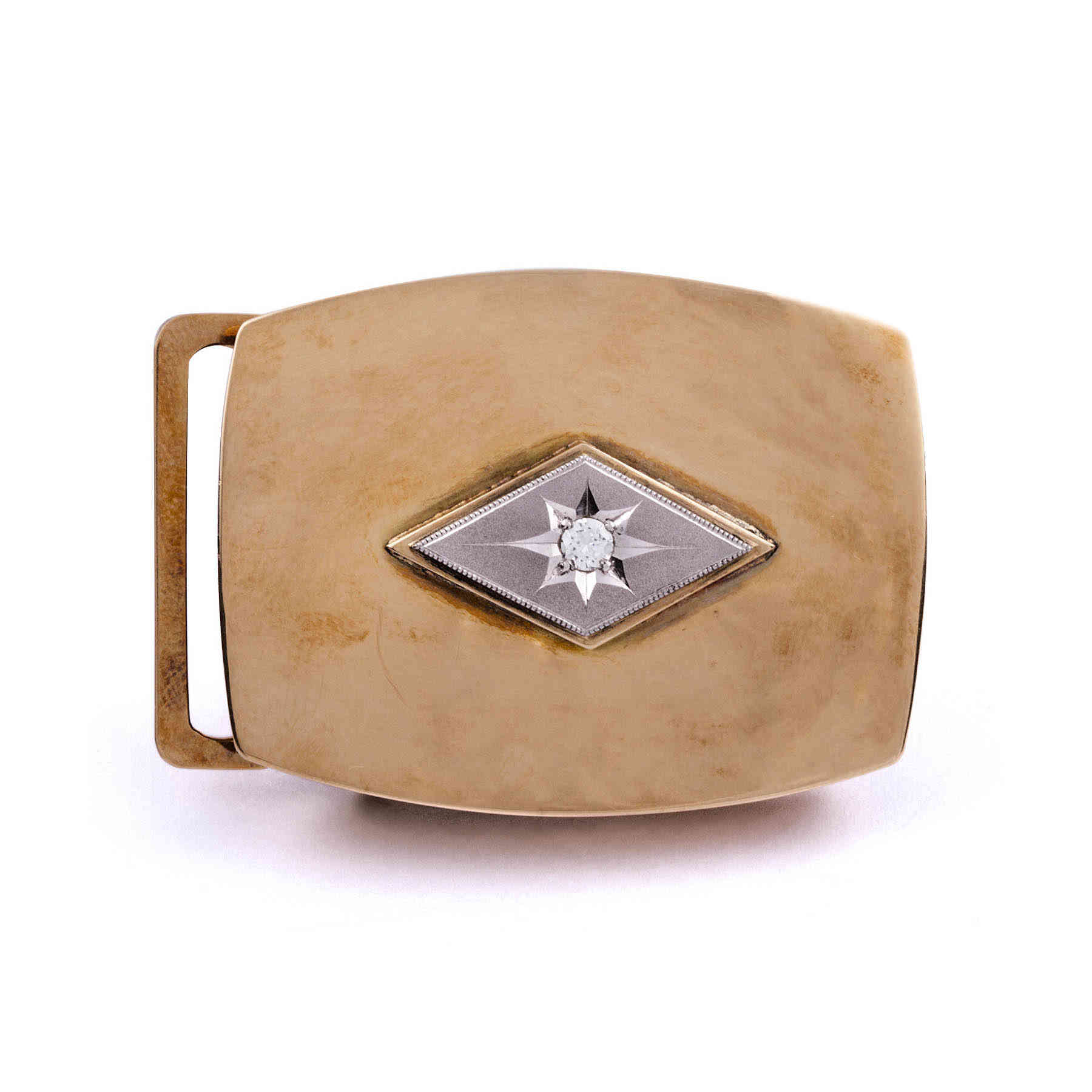 Diamond and gold belt buckle - A belt buckle centered on a single 0 ...