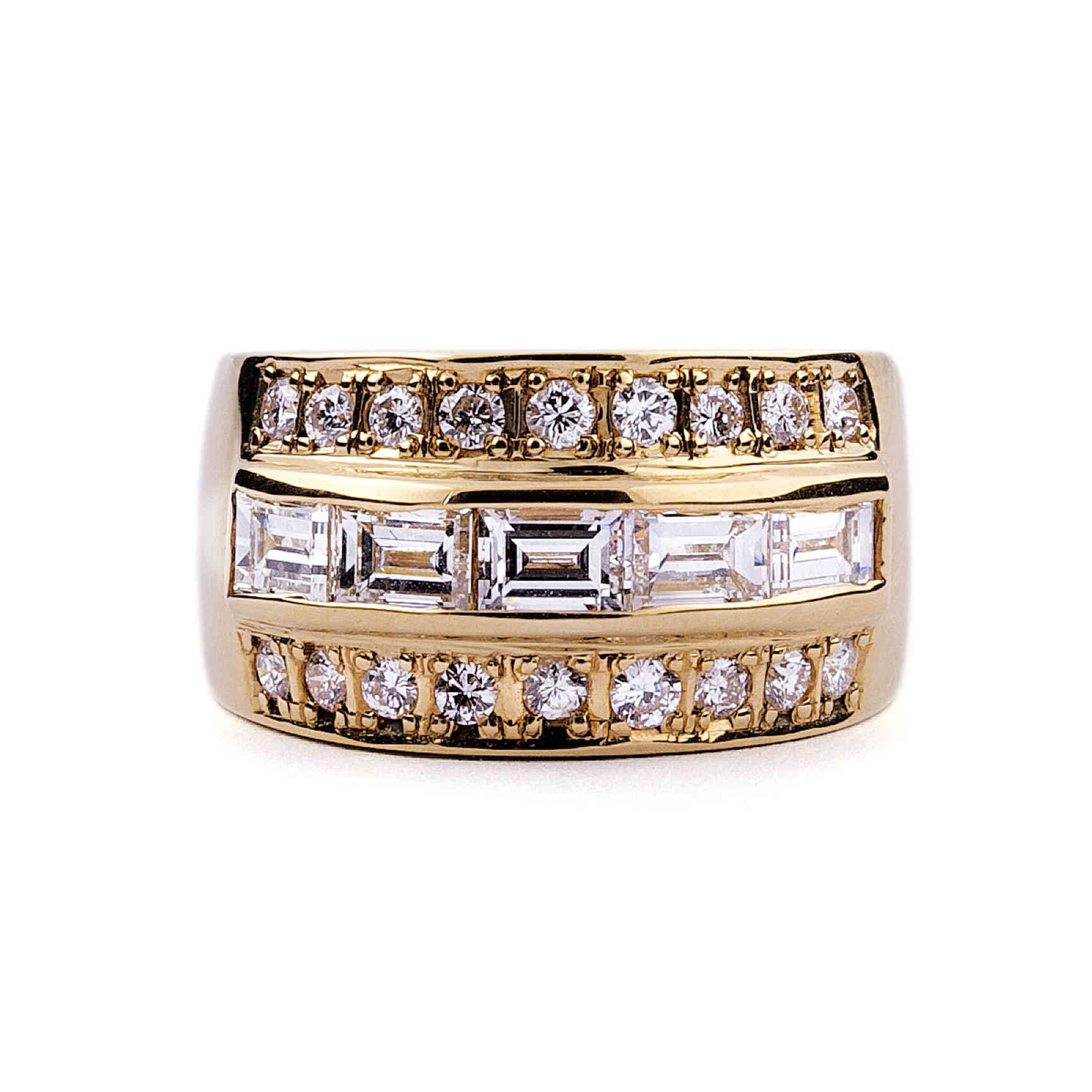 A diamond-set barrel ring - The middle row is set with 5 baguettes and ...