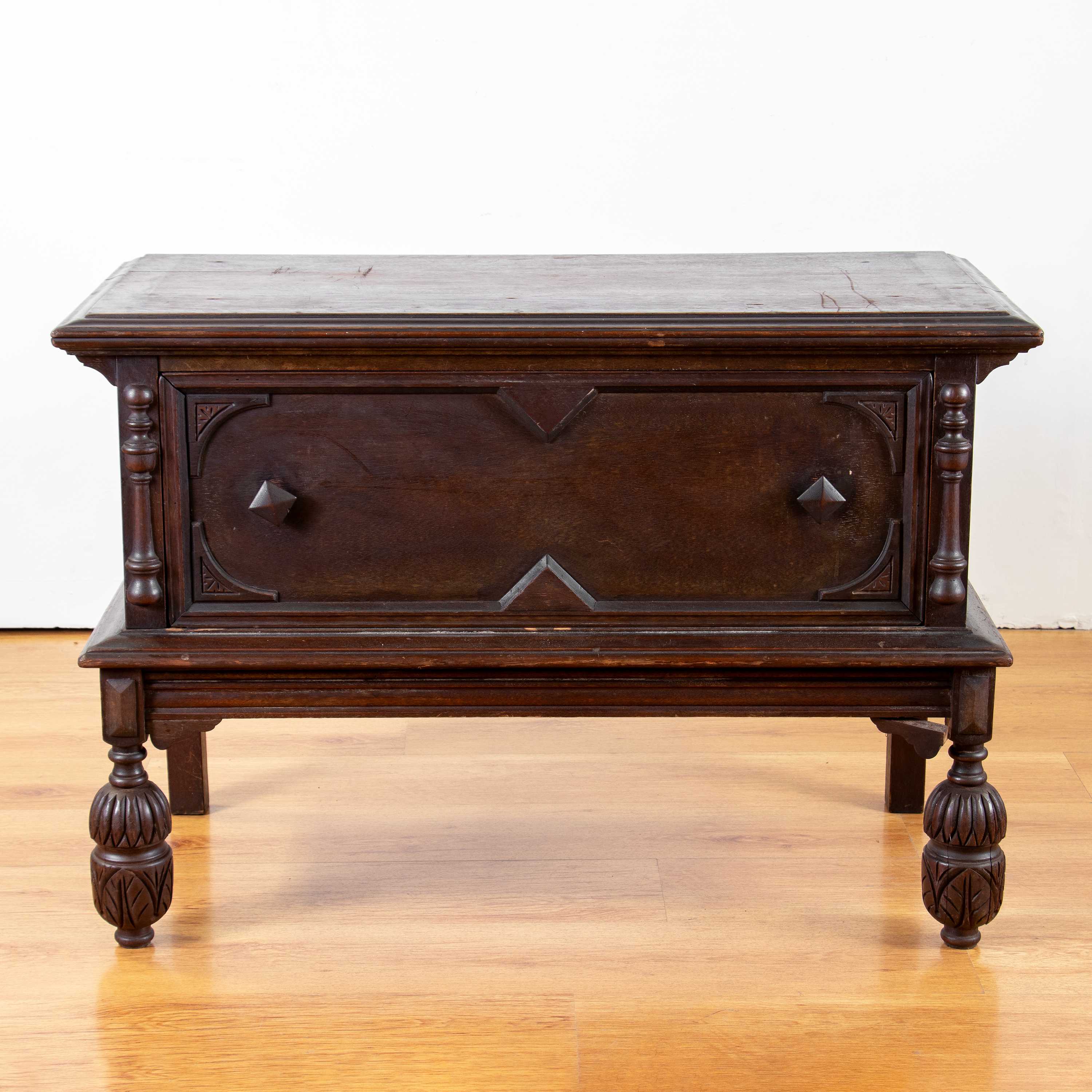 - A Renaissance Revival single-drawer chest on carved cup-and-cover feet