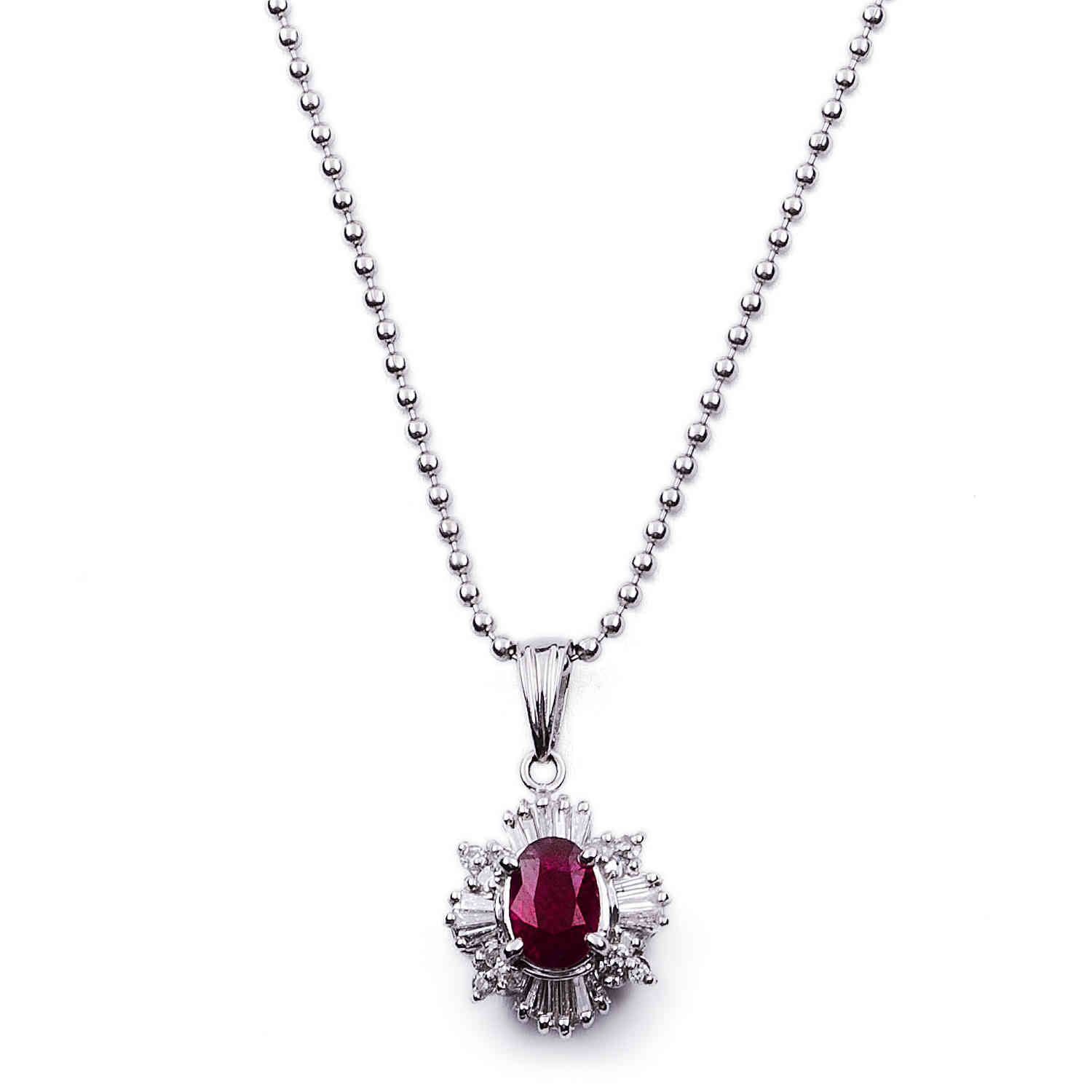 A Burmese ruby and clustered diamond pendant necklace - An oval cut ...