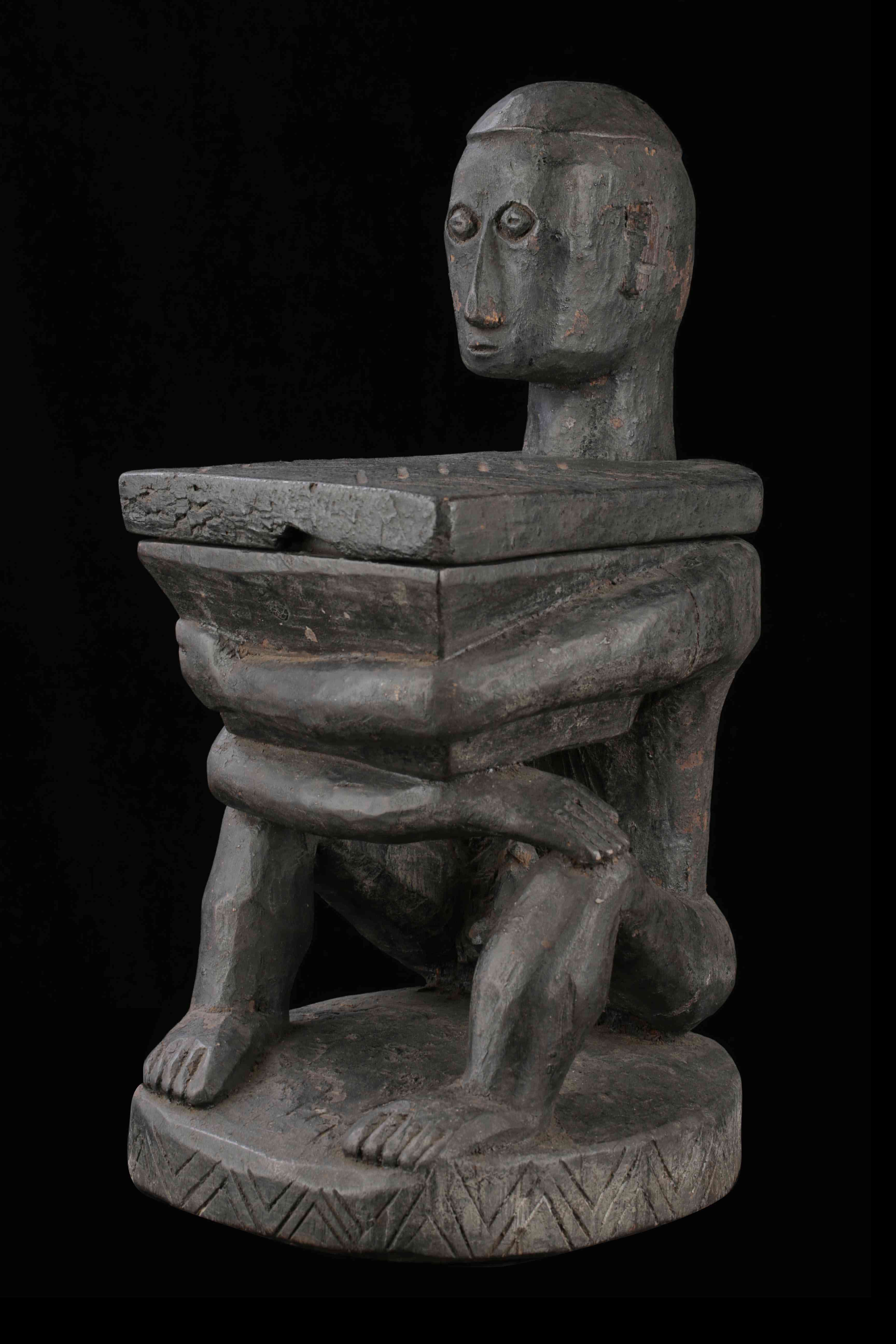 A hardwood box from Cambulo held by a male figure