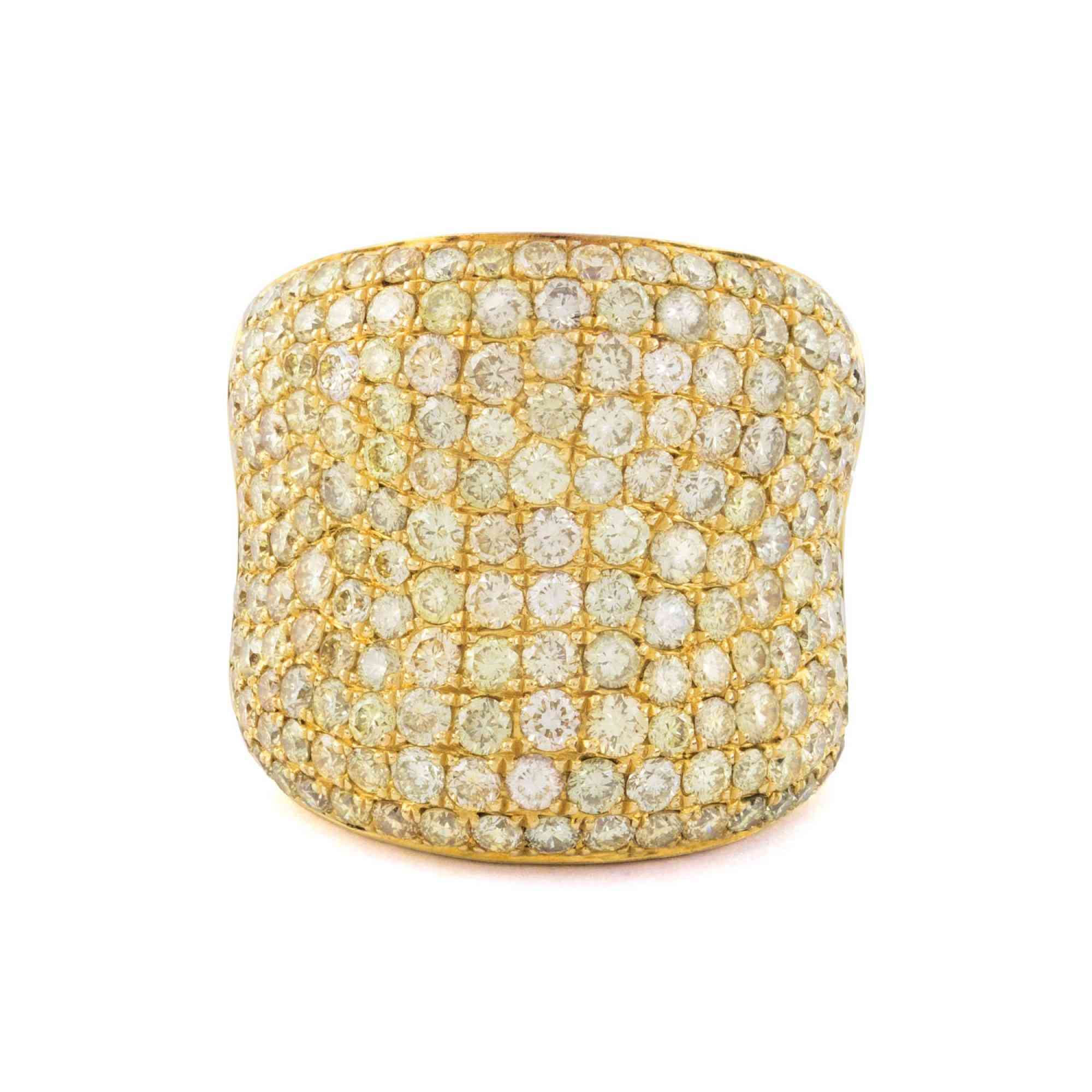 A yellow and cognac colored pavé ring