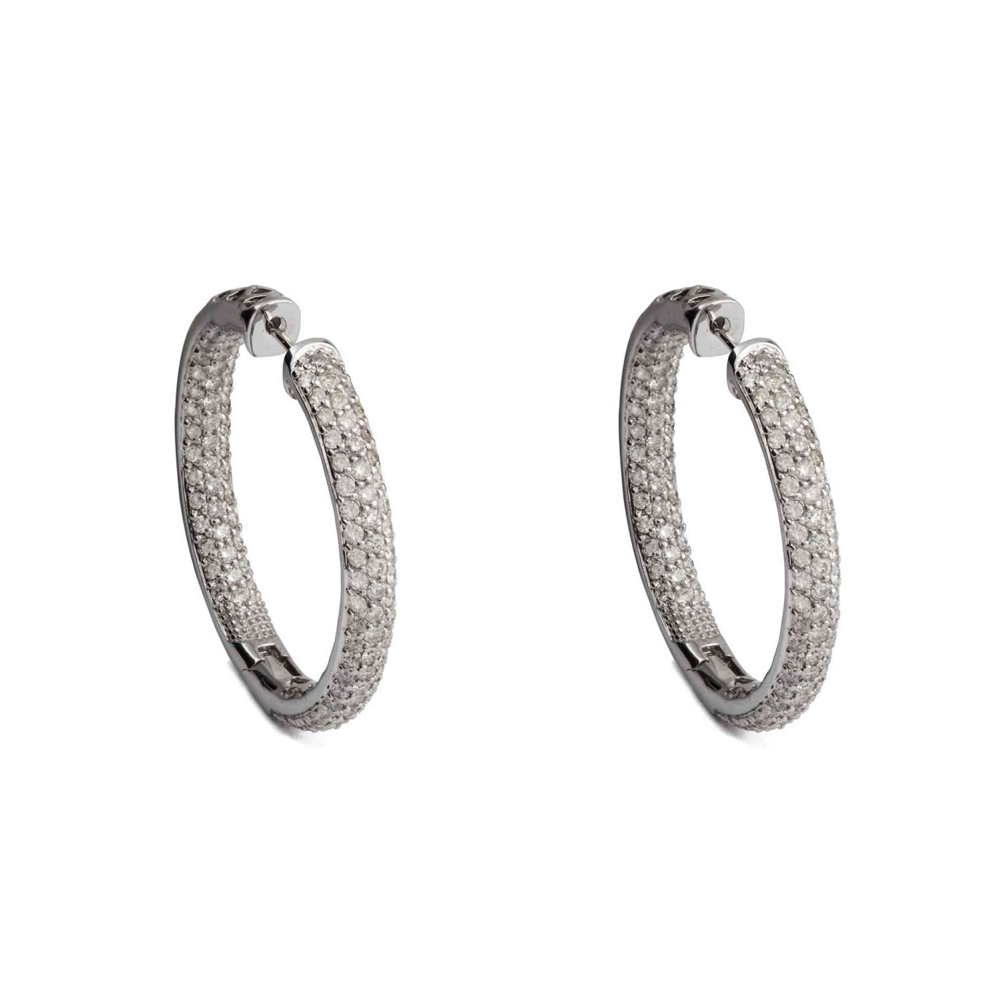 A pair of white gold diamond loop earrings