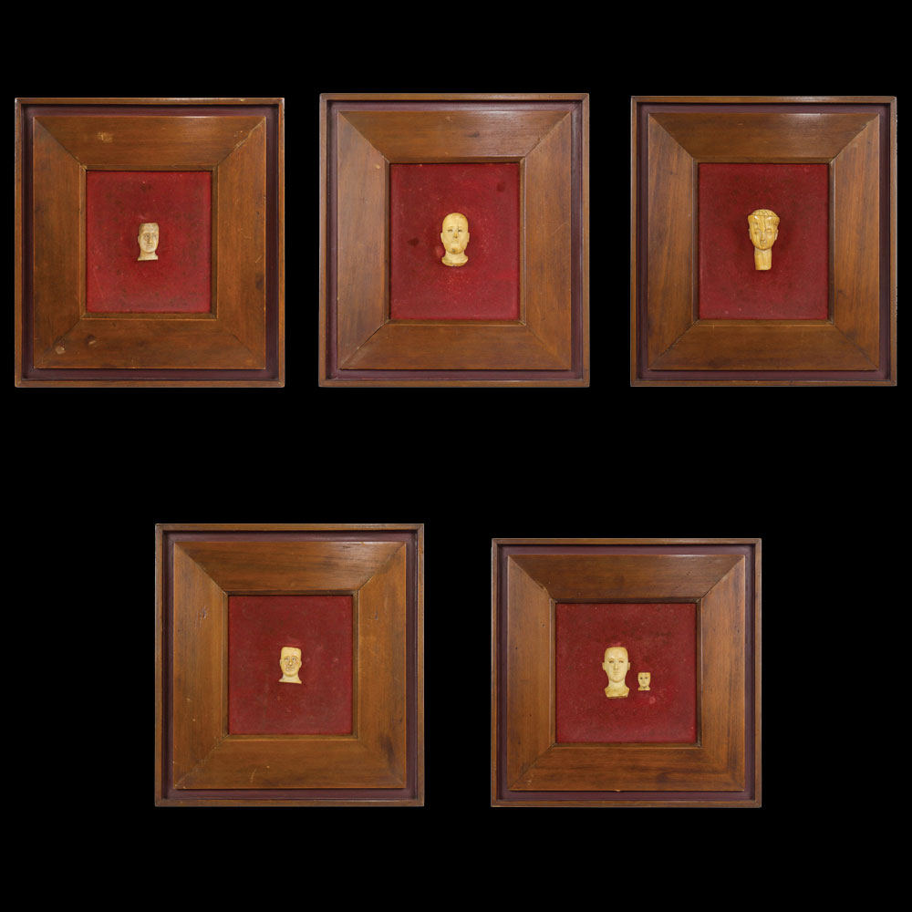 - A lot of five framed santo heads in ivory and fish bone