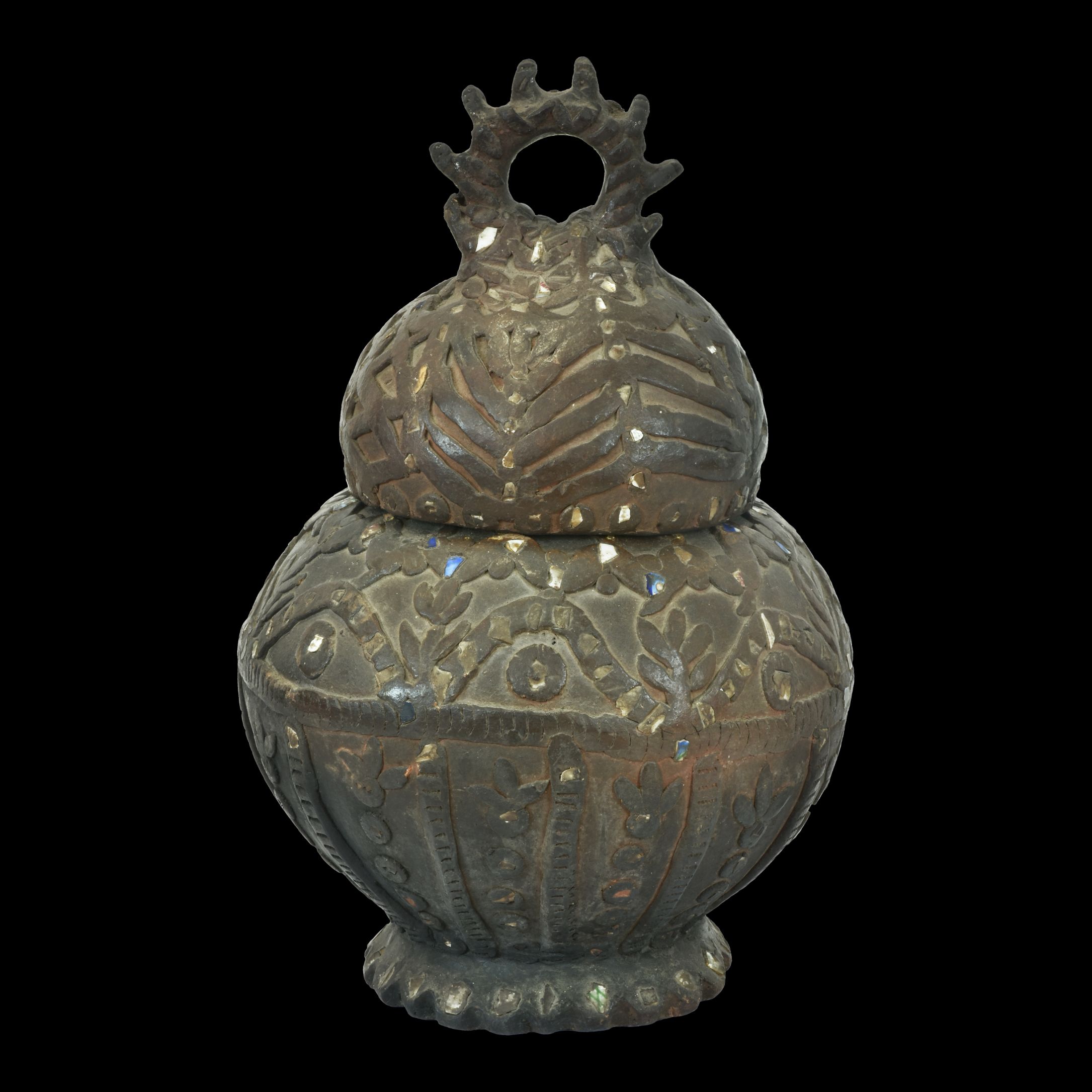 - A small Kalinga jar with cover
