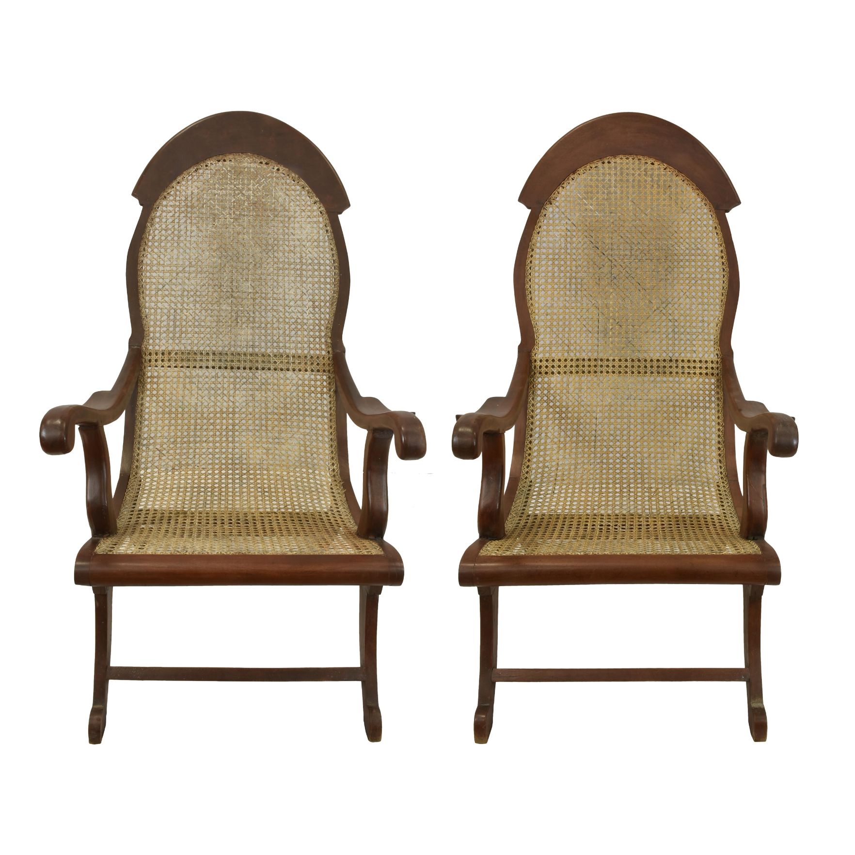 - A pair of plain-crested butaca chairs