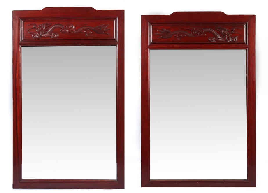 A pair of mirrors with dragon motif wood frame
