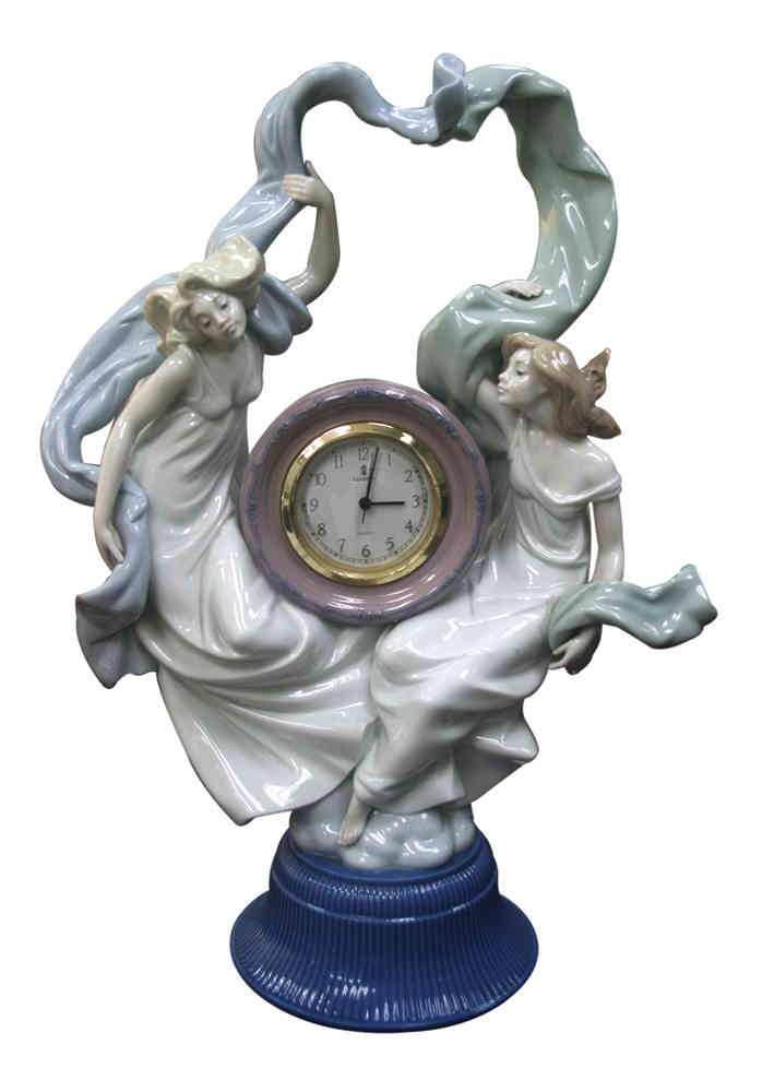 Lladro - 'An Allegory of Time' ceramic figurine with clock