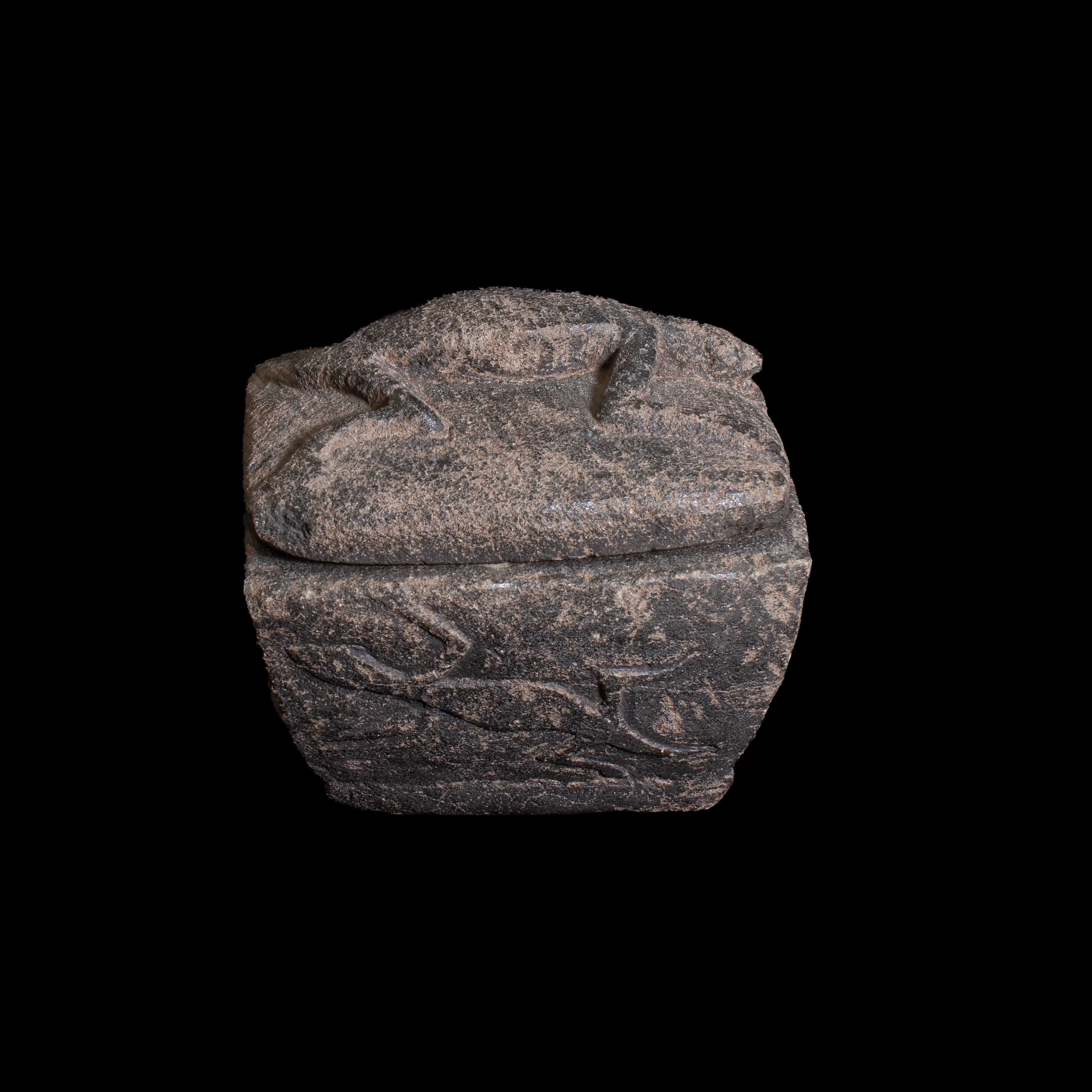 - A stone container with lizard carved lid