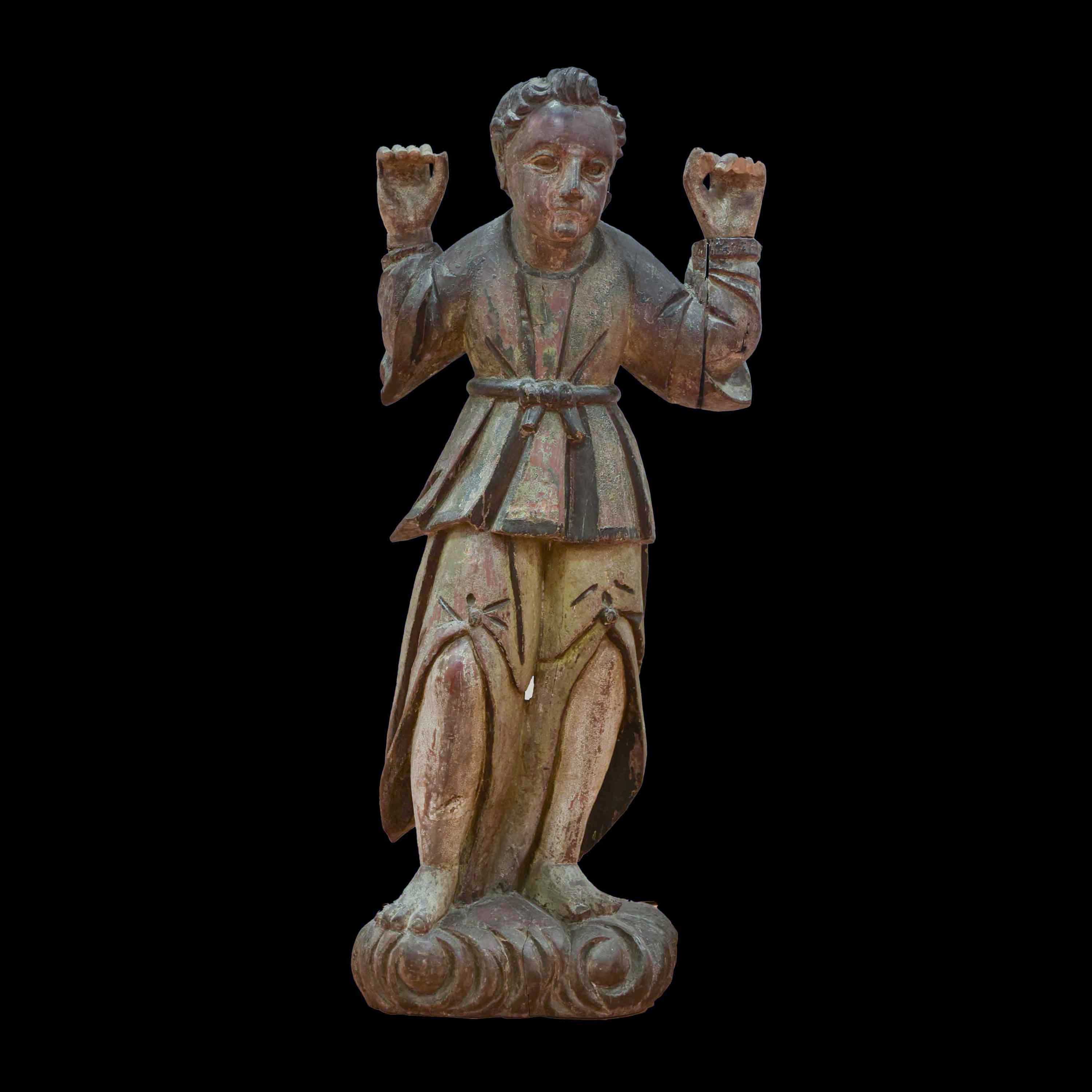 - A large wooden standing angel