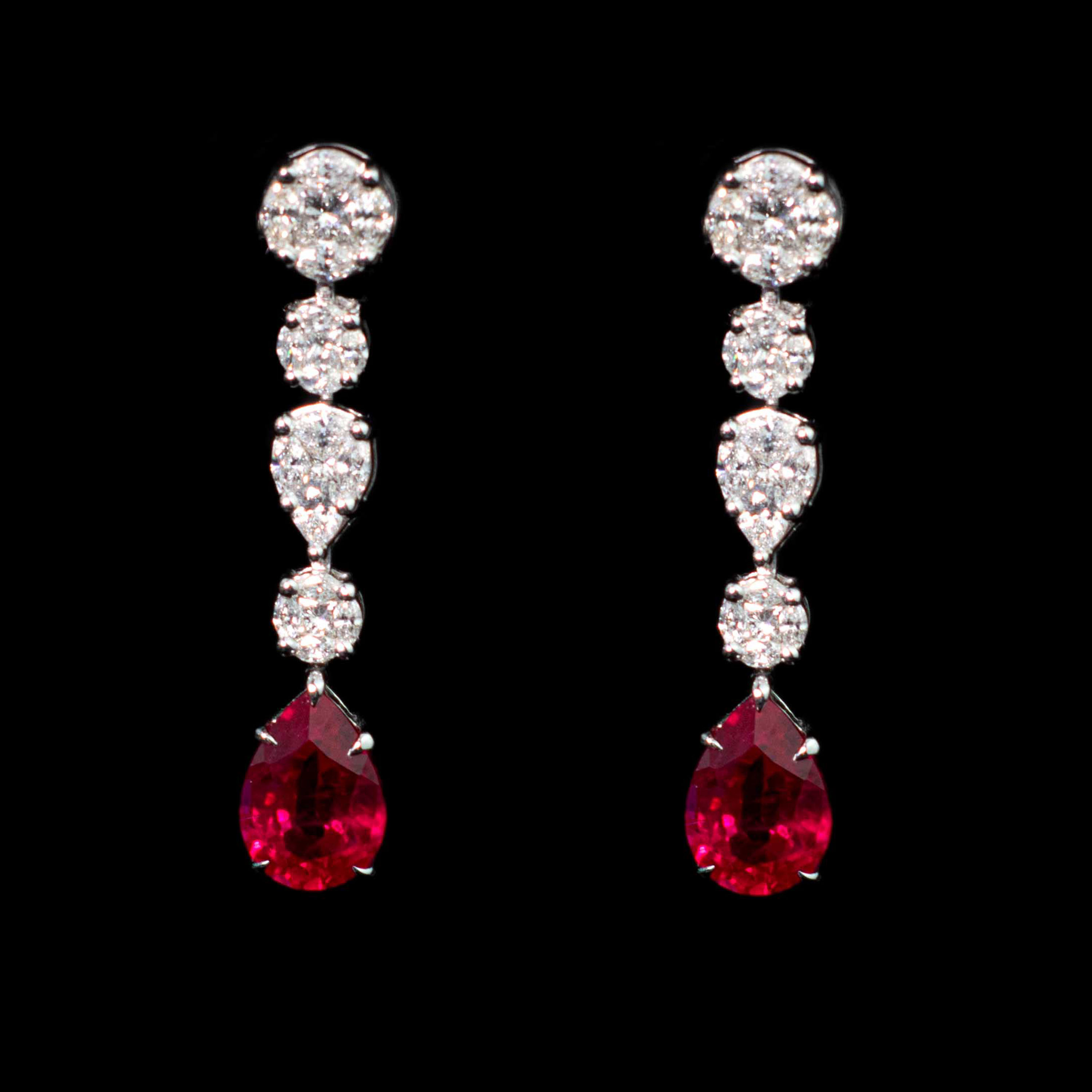 - A pair of 5.15 tcw ruby cubic zirconia and 1.72 tcw diamond earrings set in 18k white gold