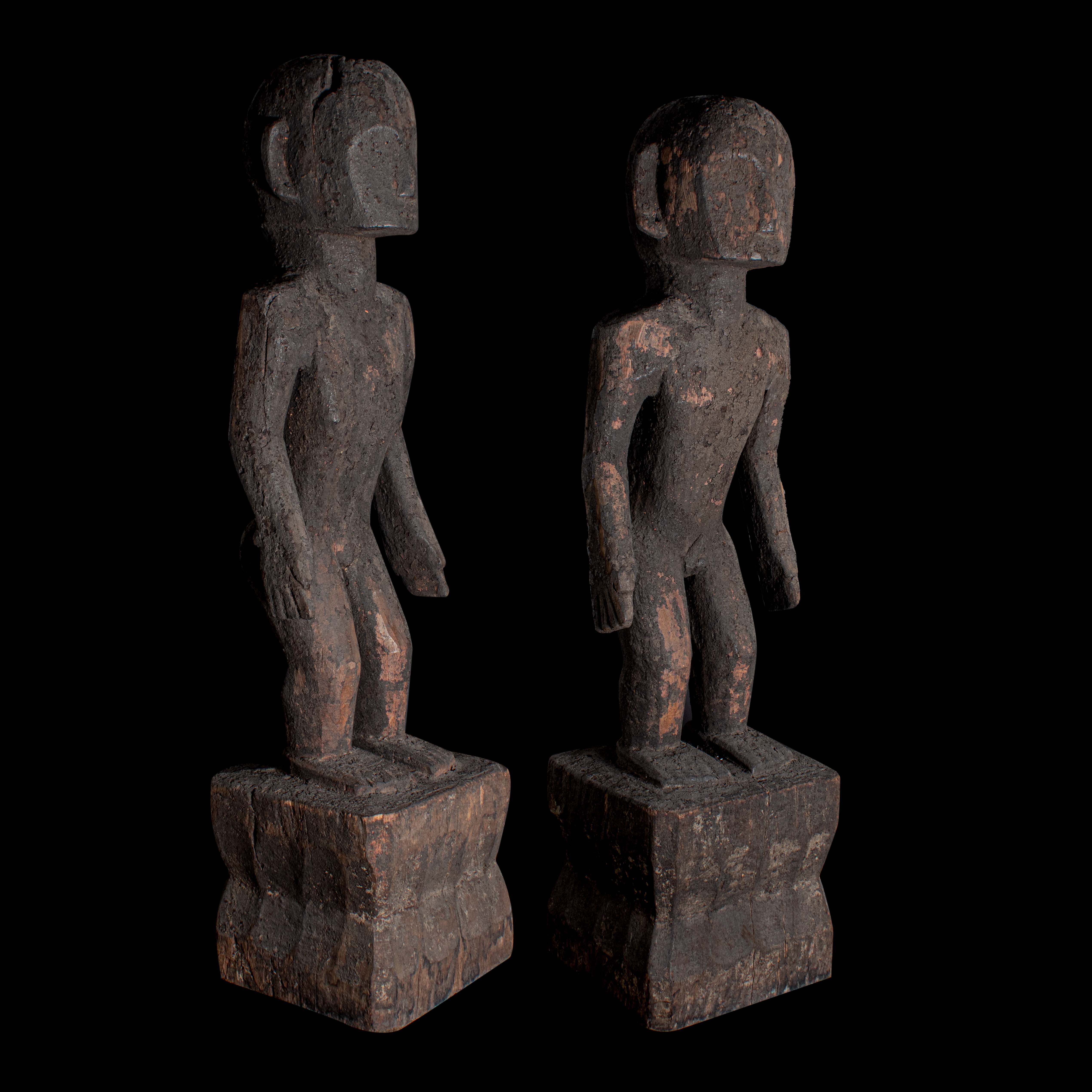 - A pair of standing male/female bulol with thick blood patina
