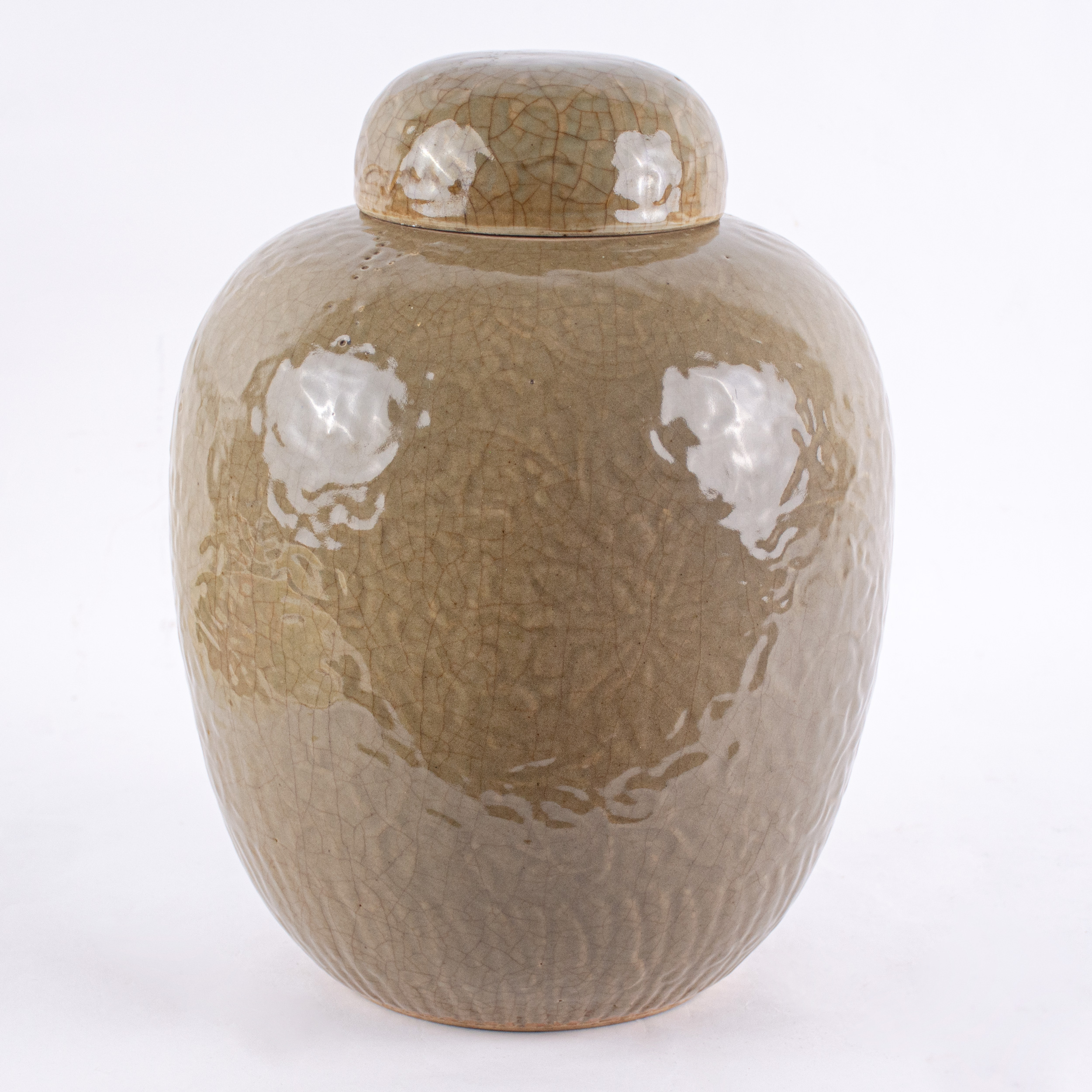 - A lidded brown jar