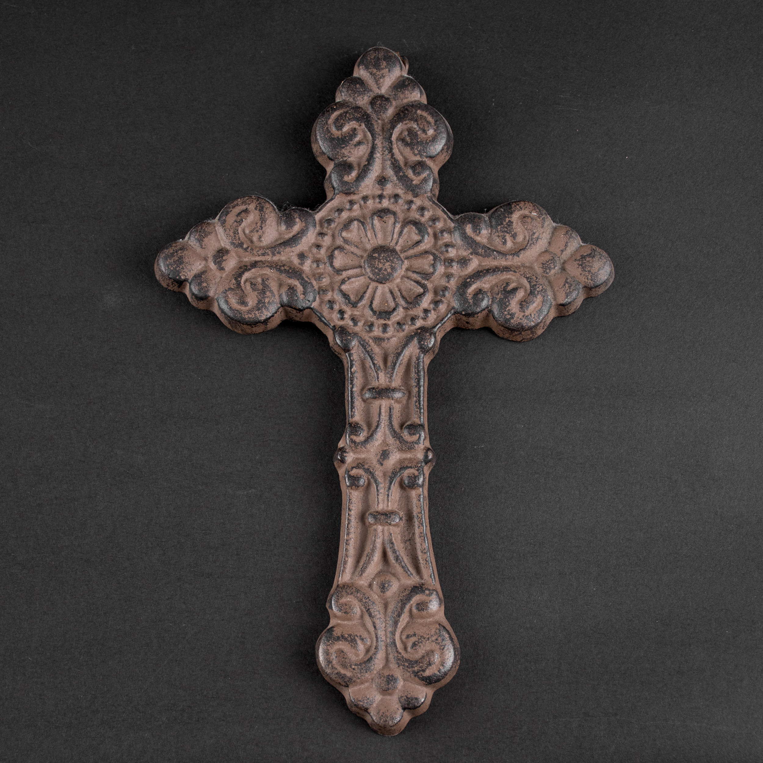 - An ornate iron wall budded cross