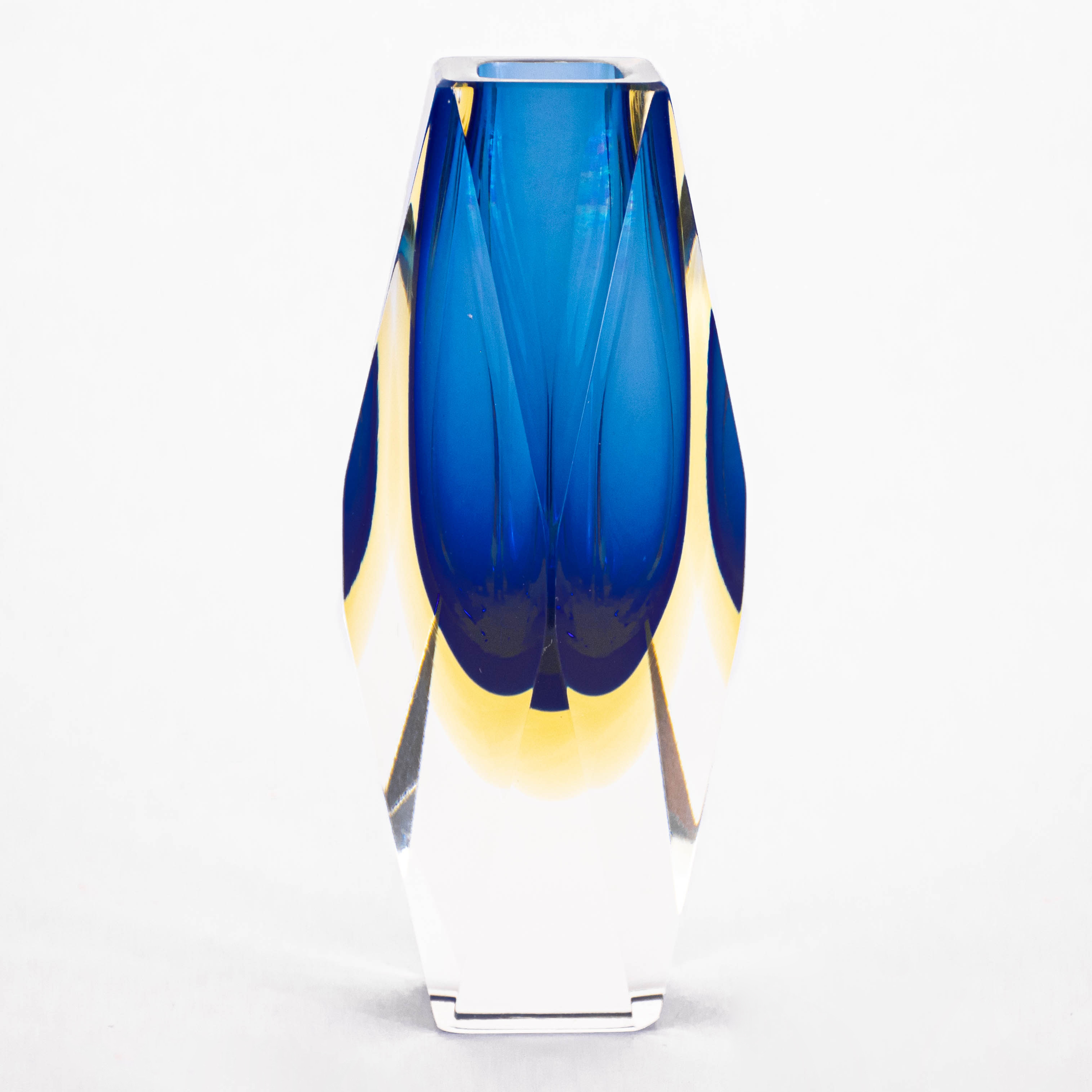 - A mid-century multi-colored multi-faceted Murano glass vase