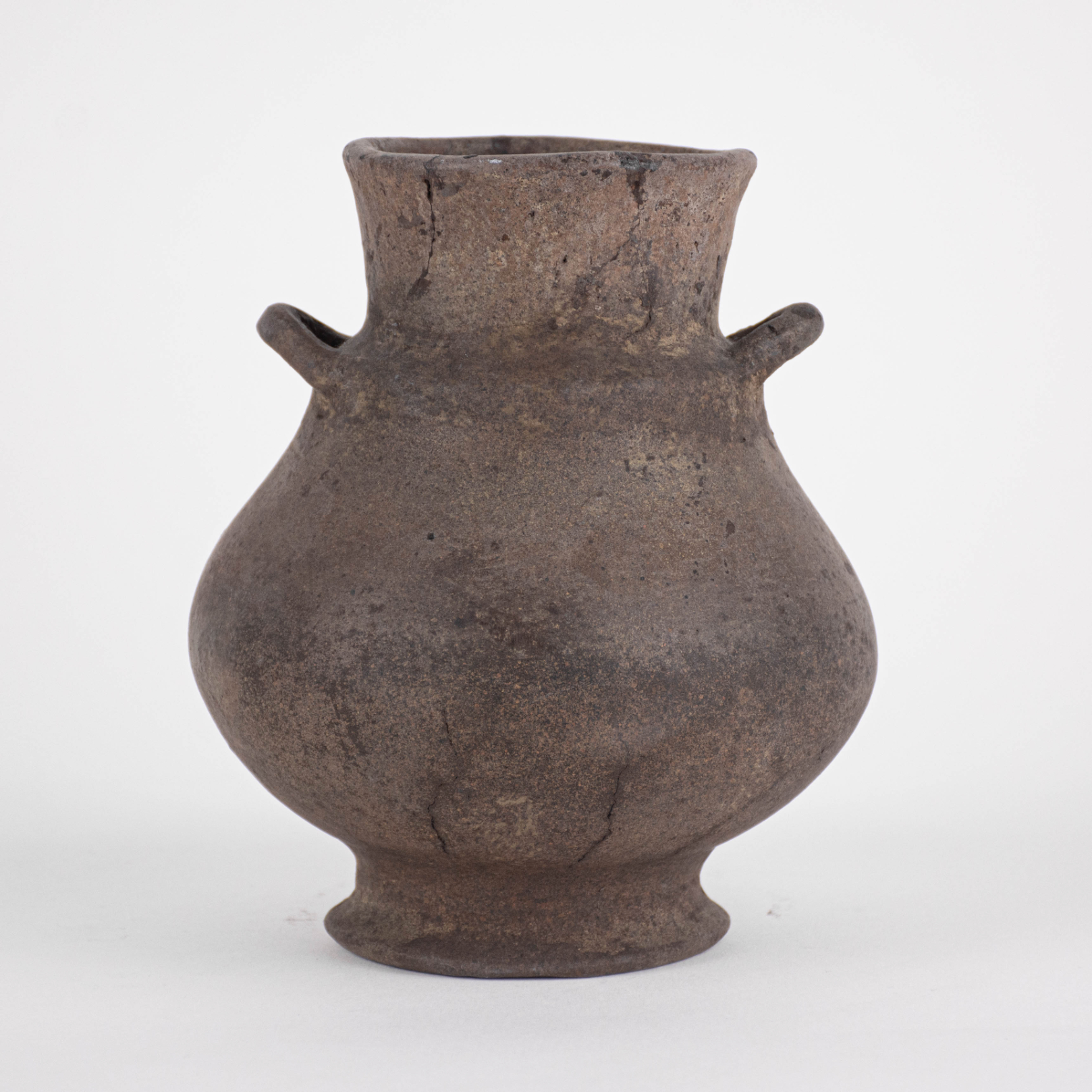 - An excavated two-eared pre-Hispanic Calatagan footed jar