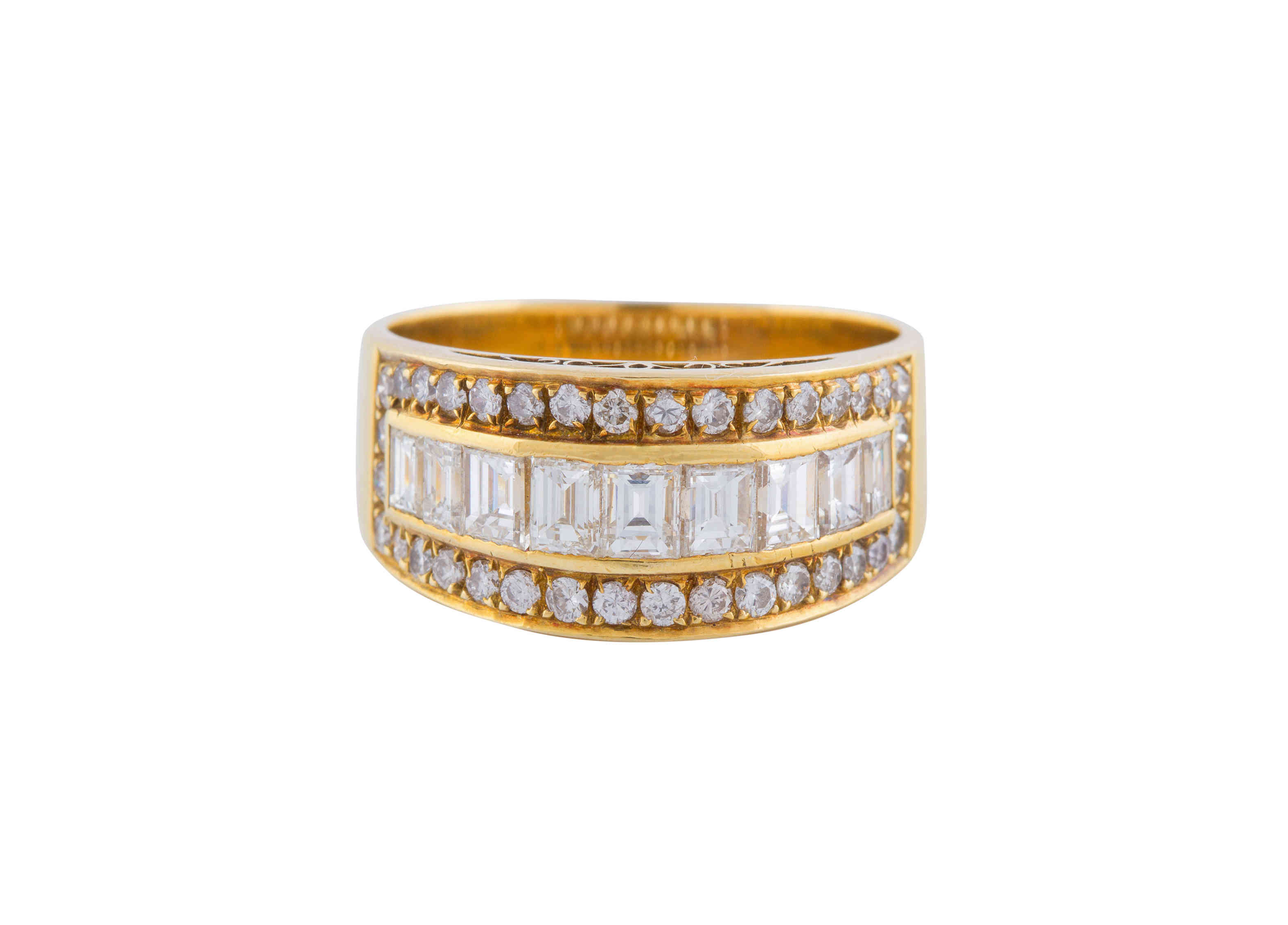A barrel design diamond ring Channel set emerald cut diamonds are ...