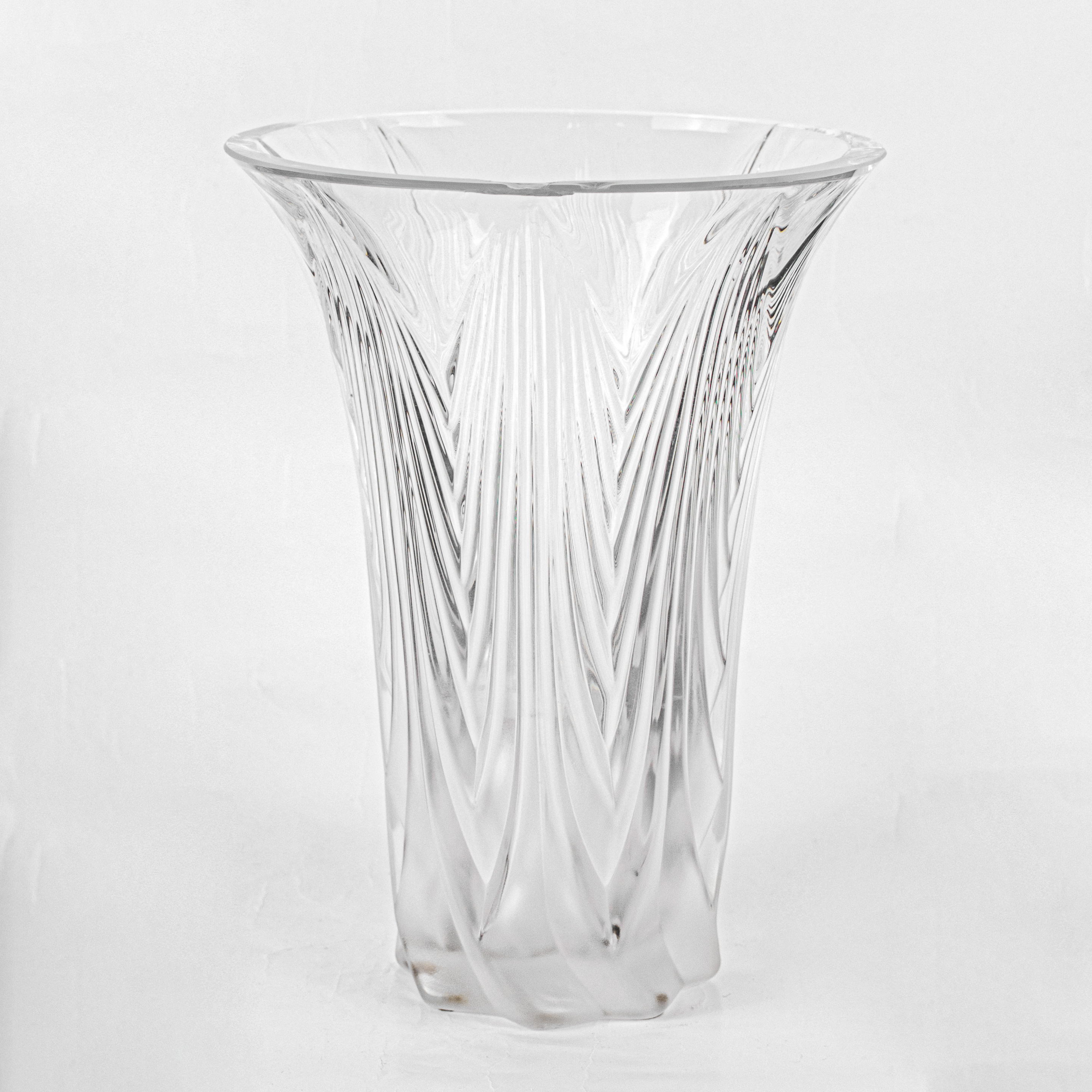 - A tall glass vase with a flared rim