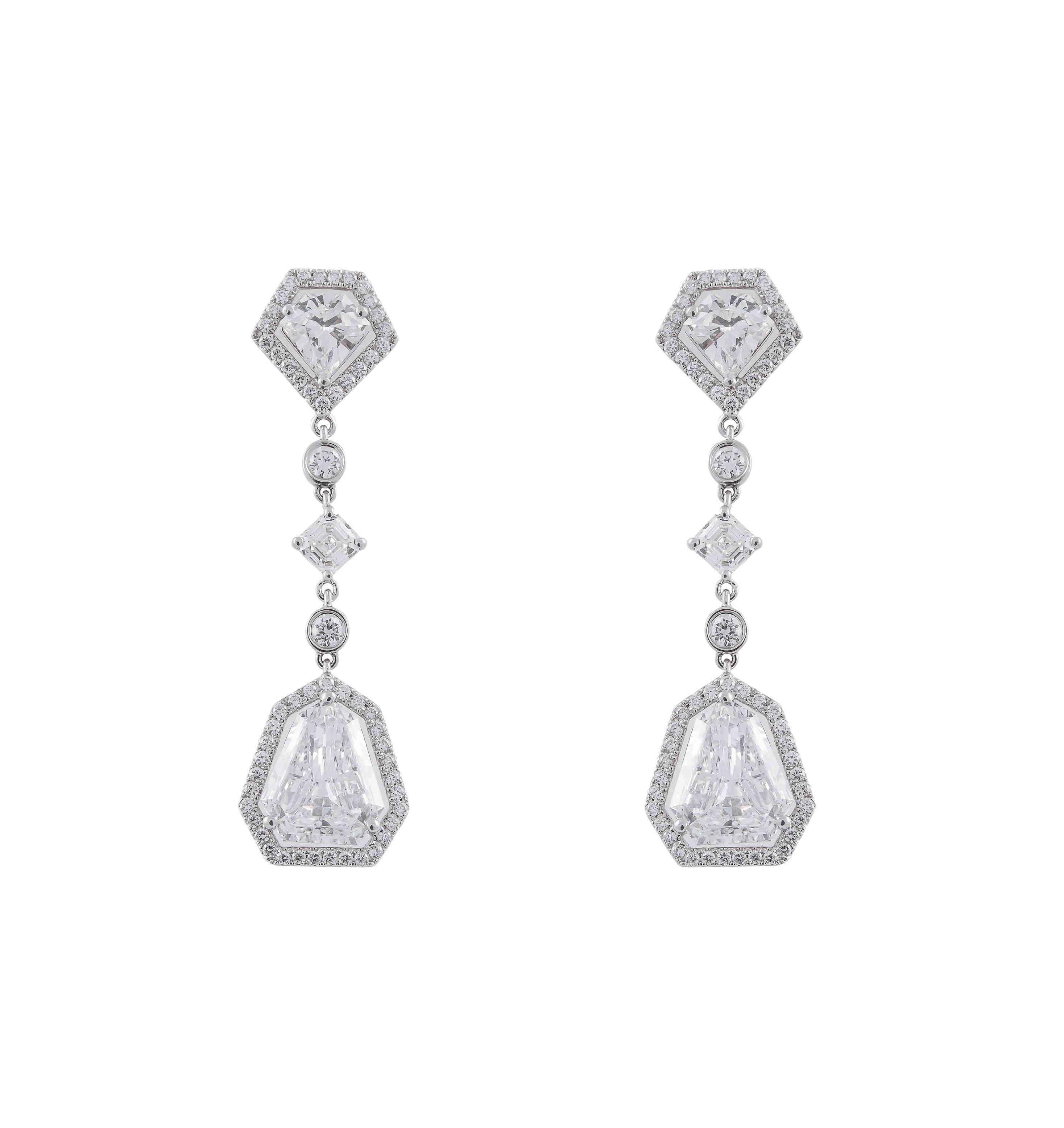 A pair of modified shield step diamond pendant earrings hanging from ...