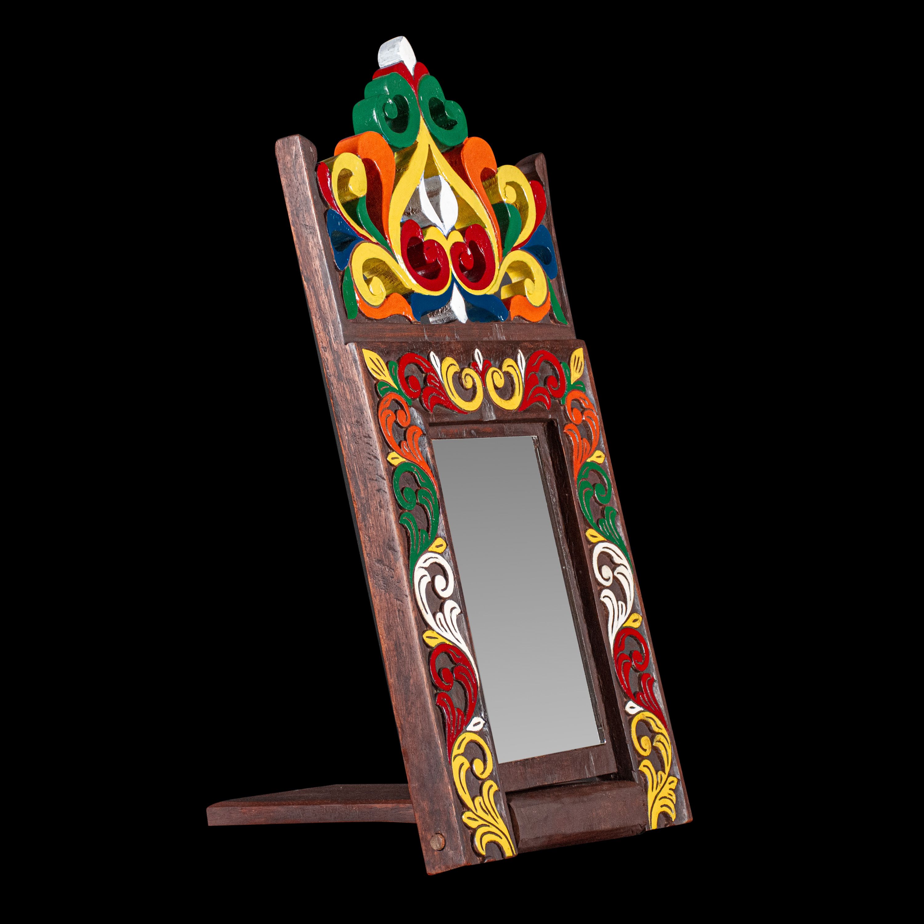 - A Maranao mirror frame, carved with elaborate 'ukkil' designs