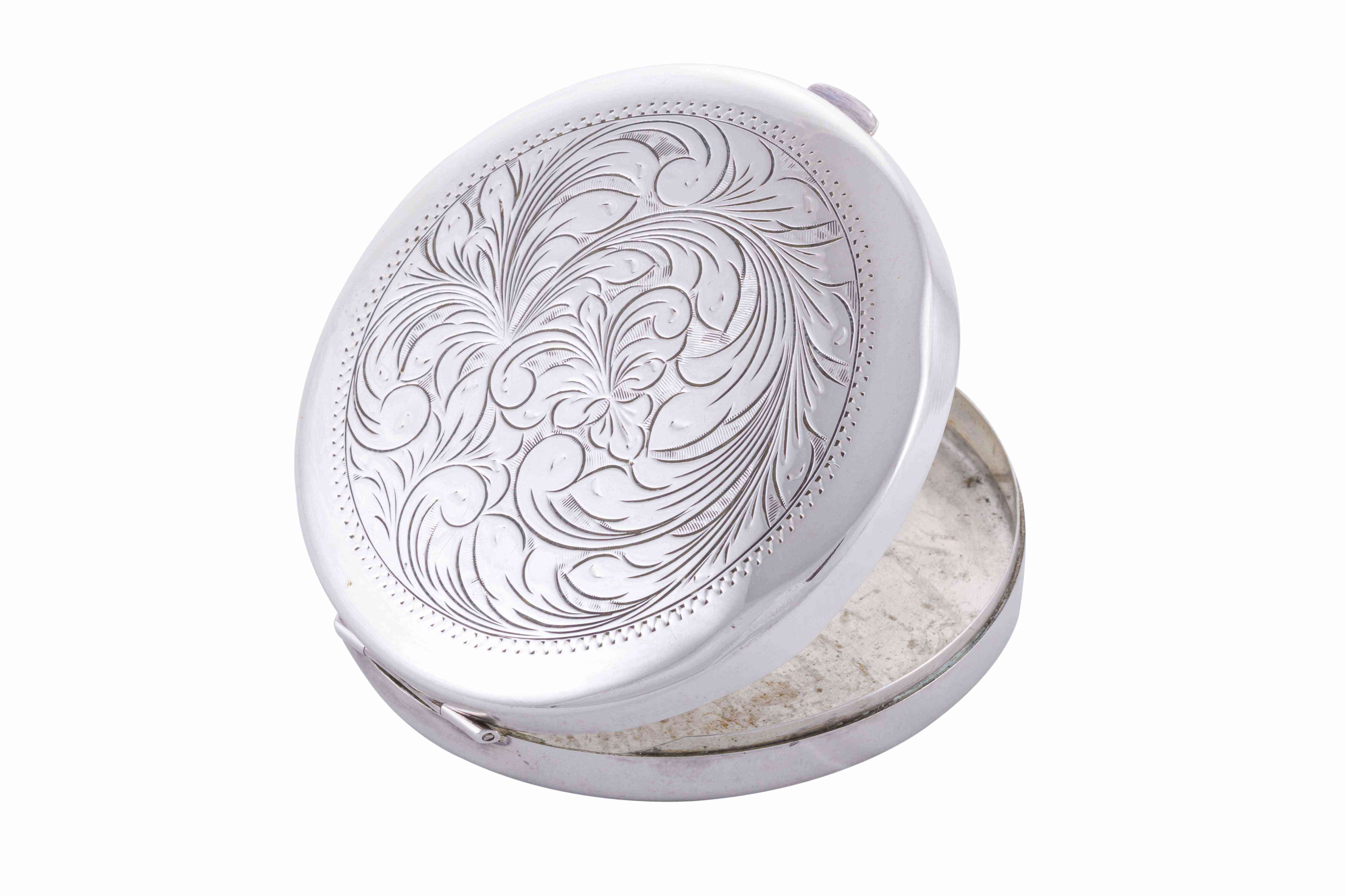 A sterling silver compact with mirror