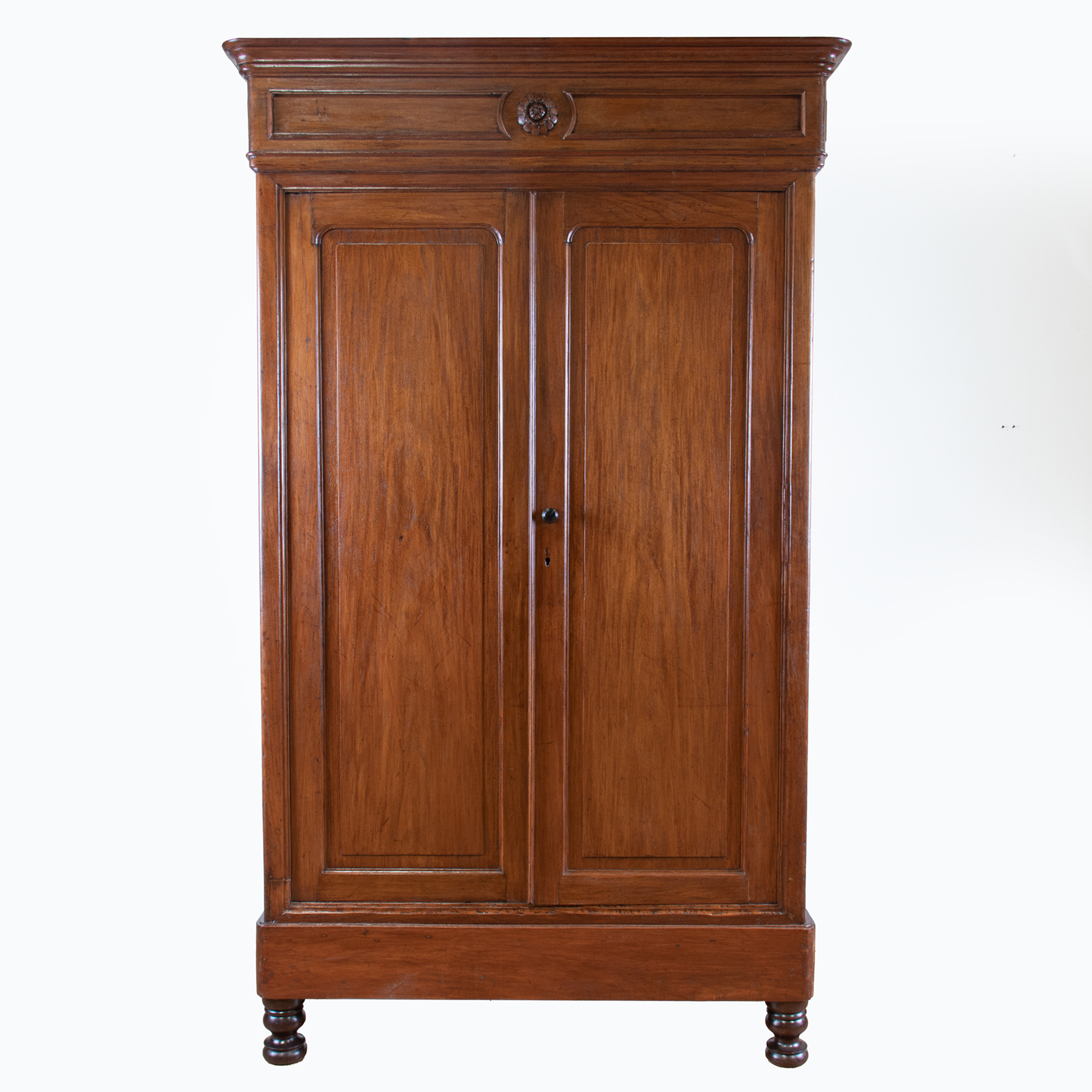 - A tambol aparador with central rosette applique