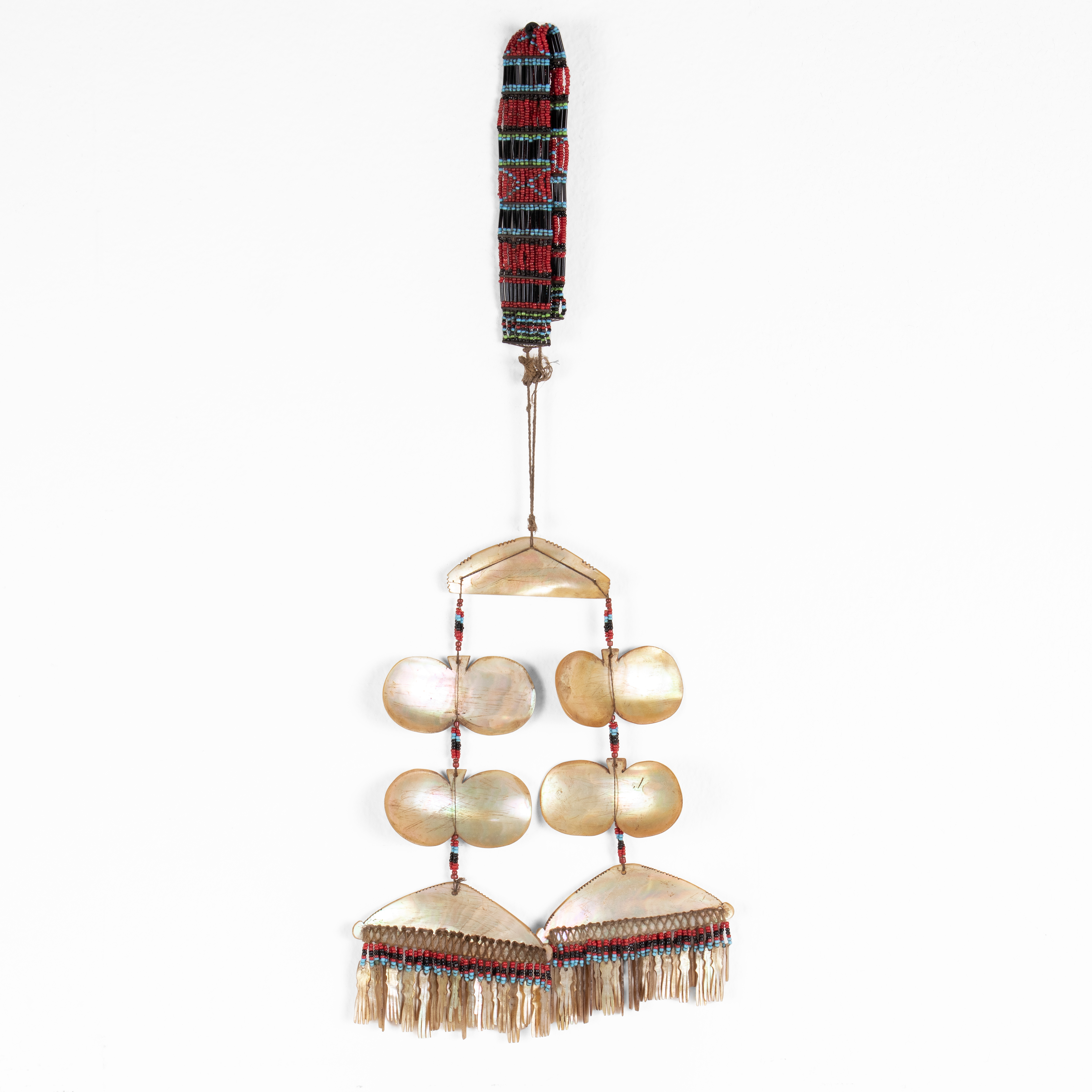 - An Isneg / Apayao breast ornament