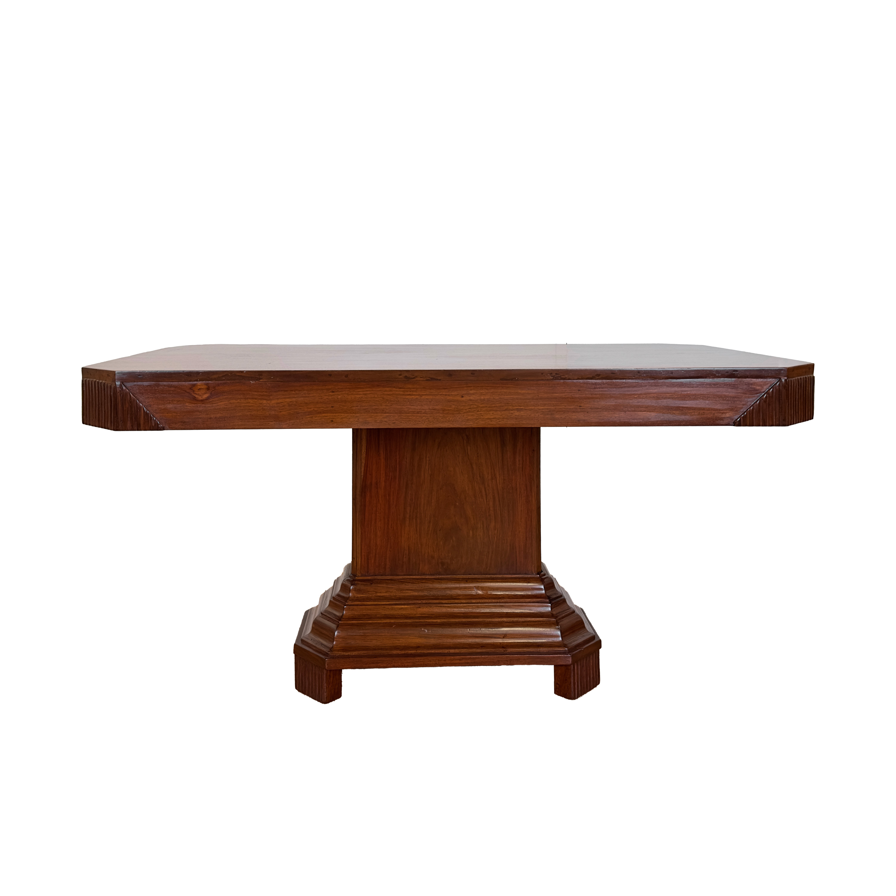 - A mid-century dining table on stepped plinth base