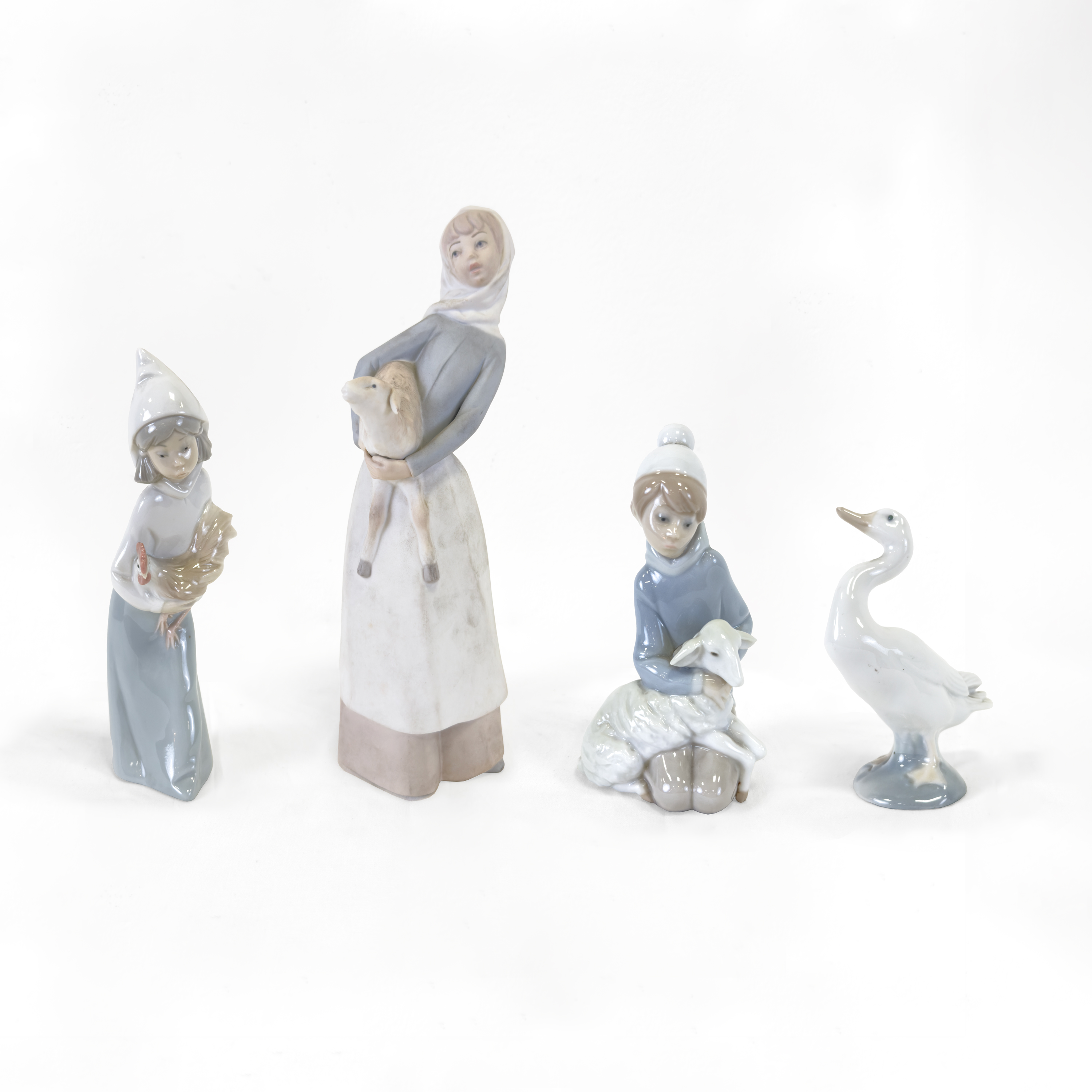 Lladró - A lot of four figures: Girl with Lamb, Shepherdess with ...