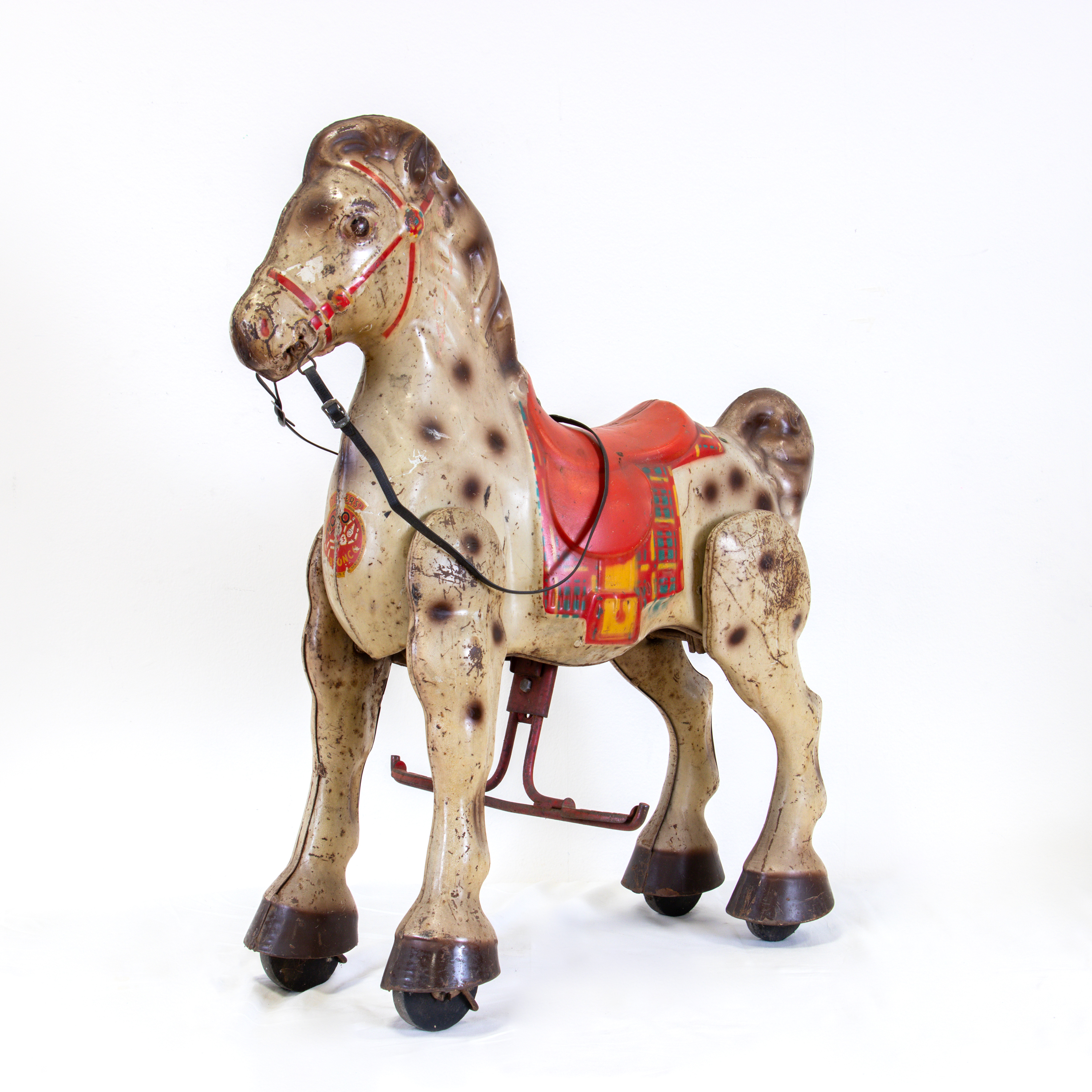 - A ride-on pedal Mobo Bronco horse