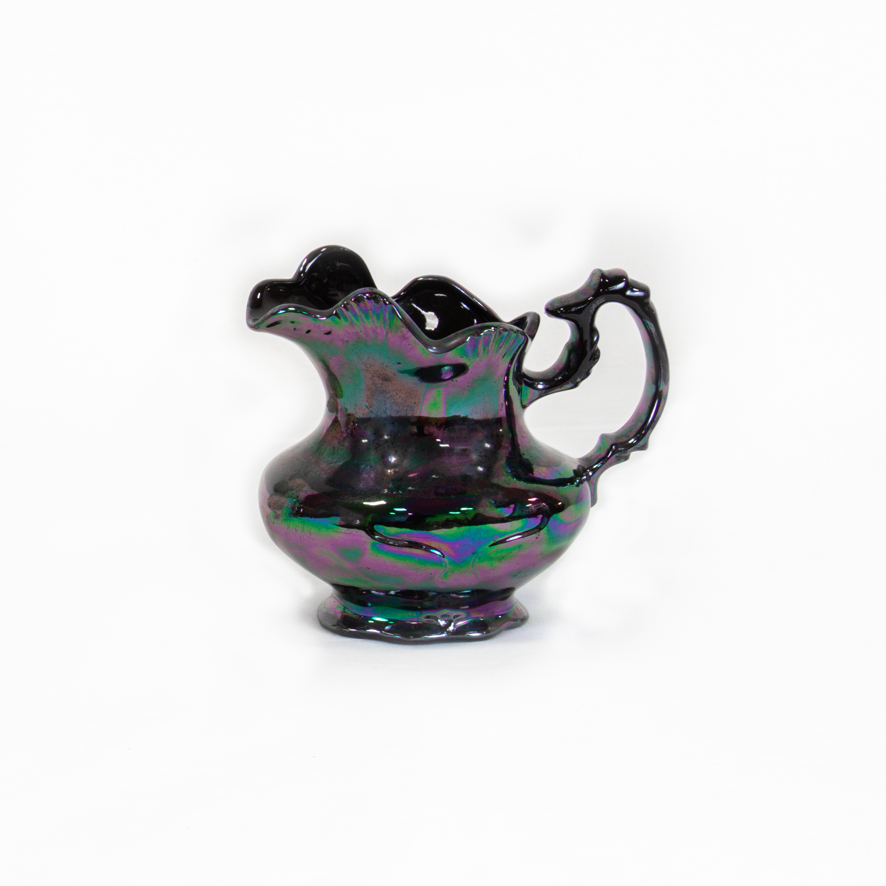 - A mini glass blueberry carnival pitcher